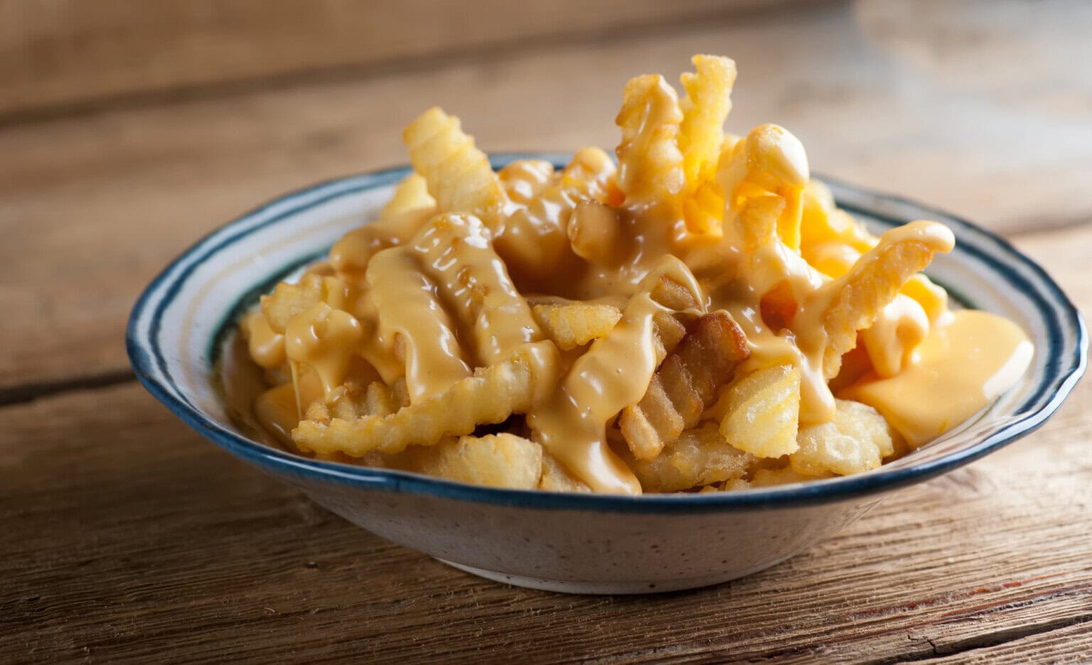 Easy Cheese Fries with Creamy Velveeta Sauce - Framed Cooks